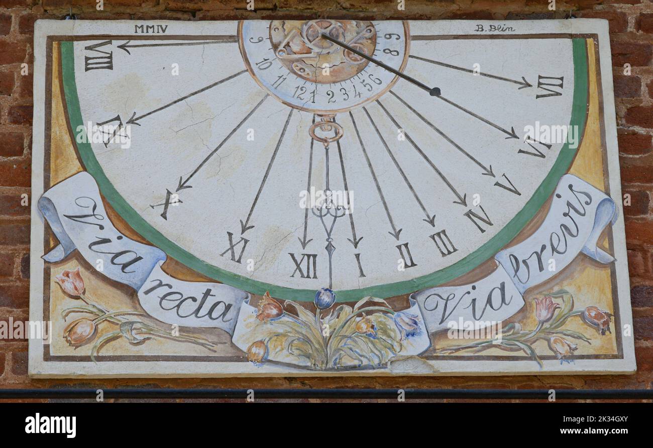 Pralormo, Italy, May 2022 Beautiful sundial painted on the wall of the ...