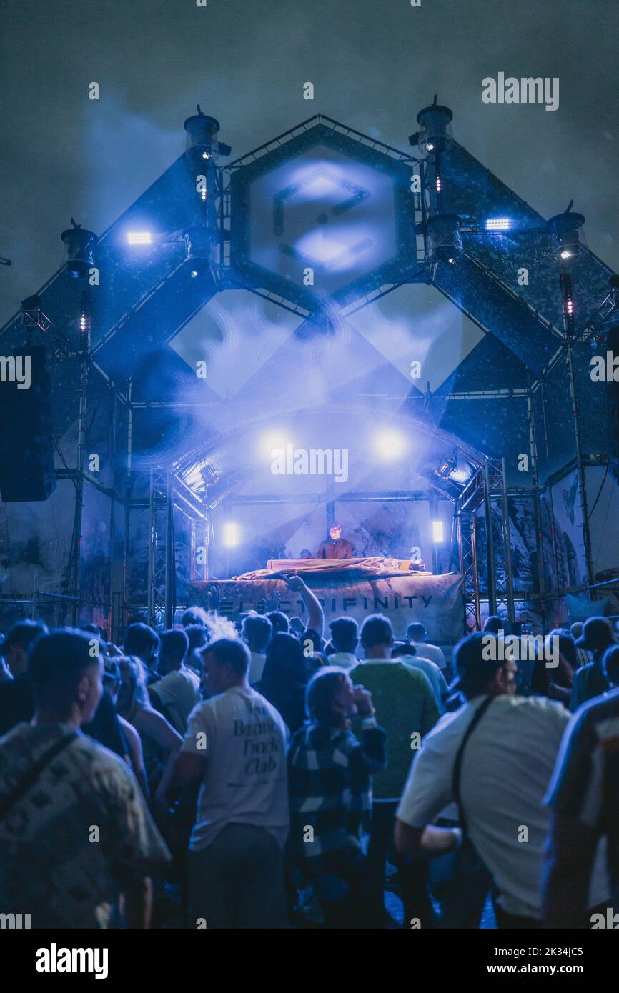 A stage and dancing crowd at Electrifinity Indoor & Outdoor Music ...