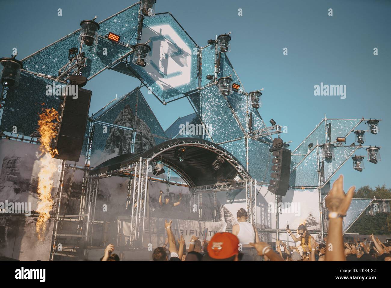A stage and dancing crowd at Electrifinity Indoor & Outdoor Music ...