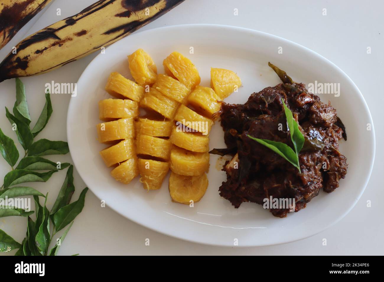 Mutton roast and steamed ripe plantain. A spicy and sweet combination ...