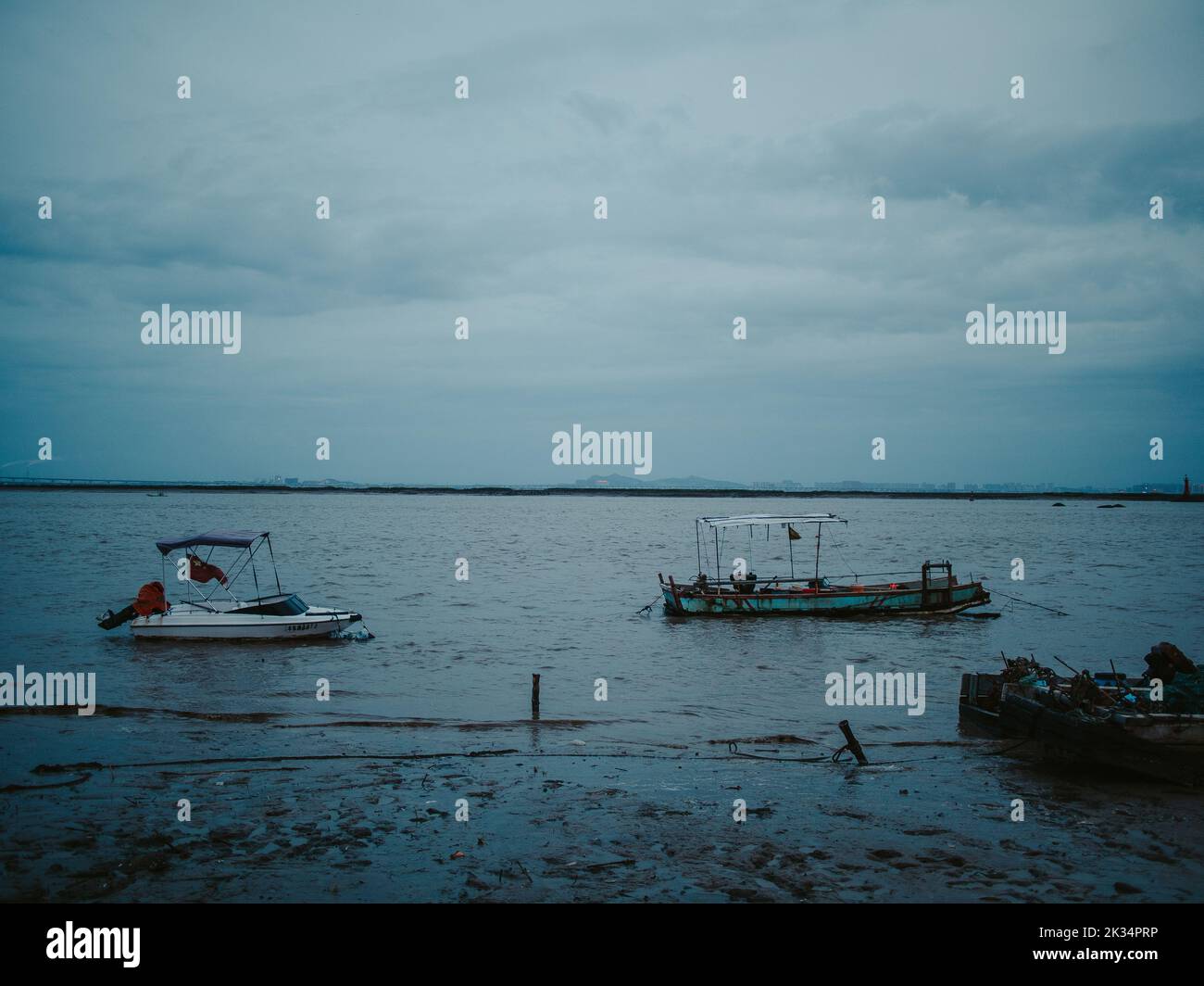 A Moody view of a harbor under a cloudy sky Stock Photo - Alamy