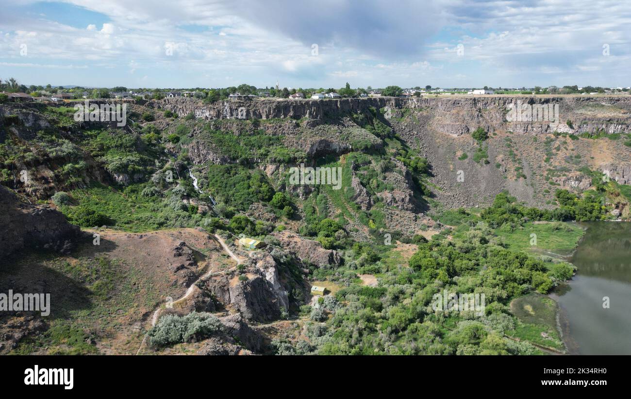 An aerial view of the river surrounded by rocks and cliffs Stock Photo ...