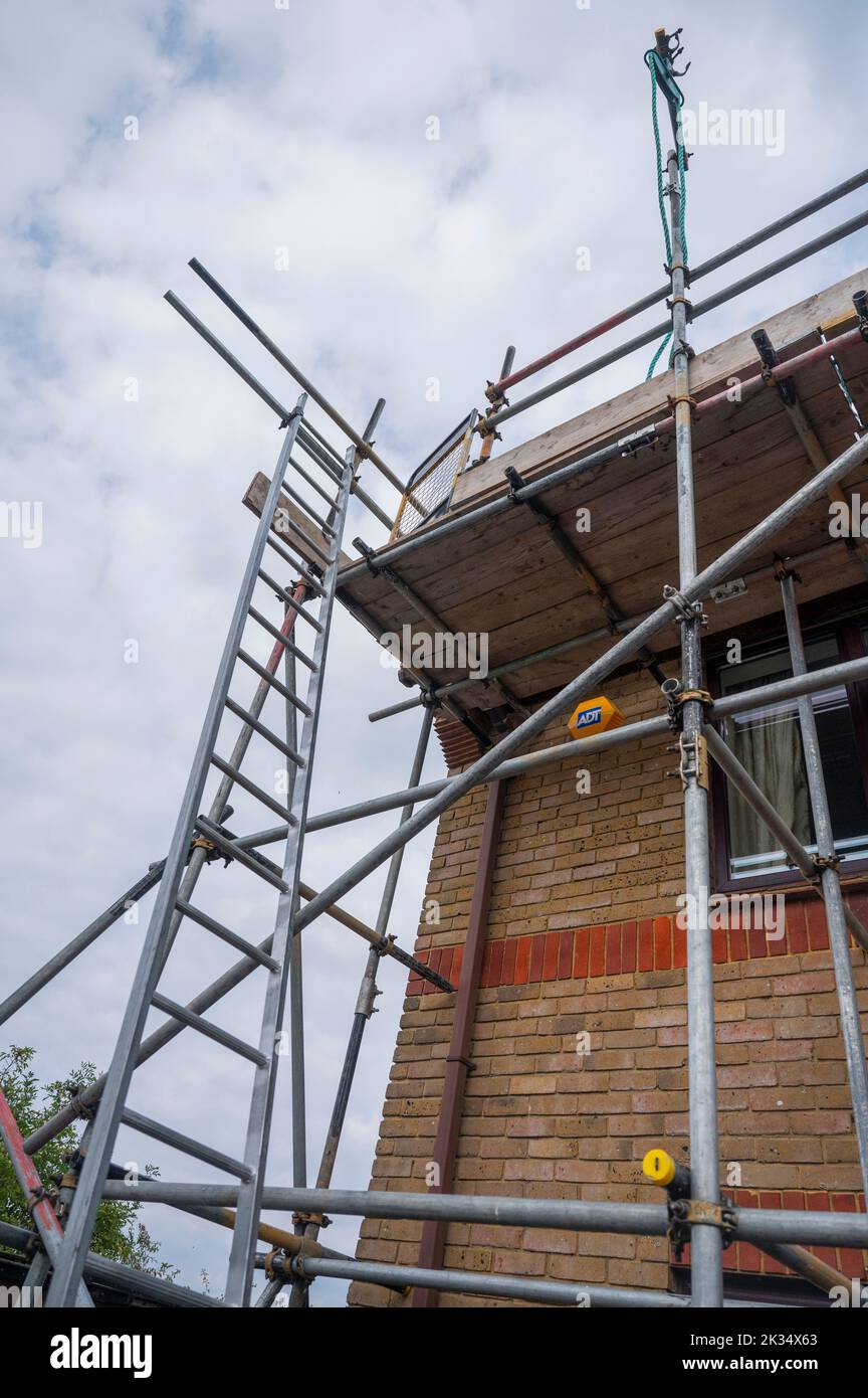 scaffolding around a house in the UK Stock Photo - Alamy