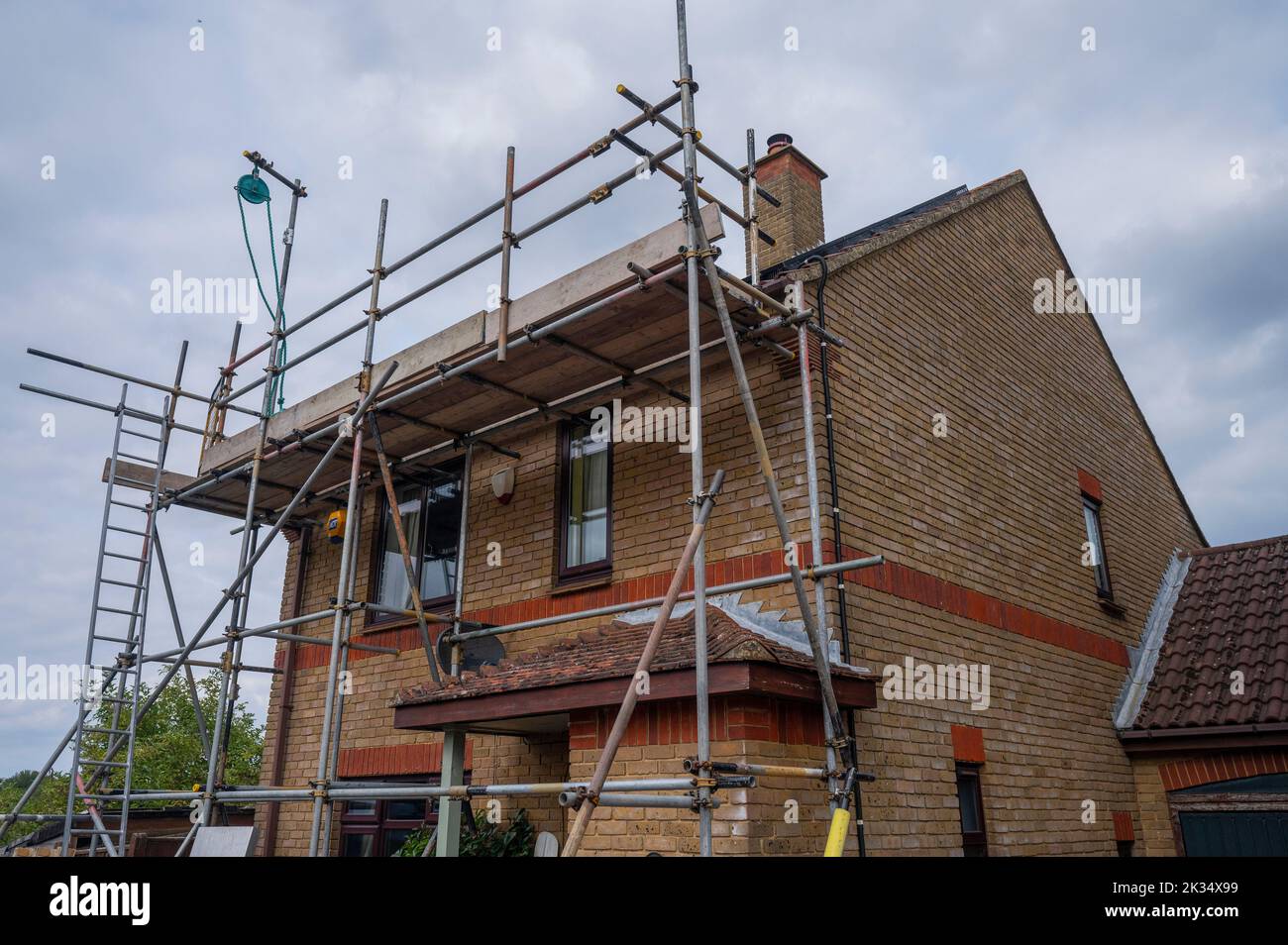 scaffolding around a house in the UK Stock Photo - Alamy