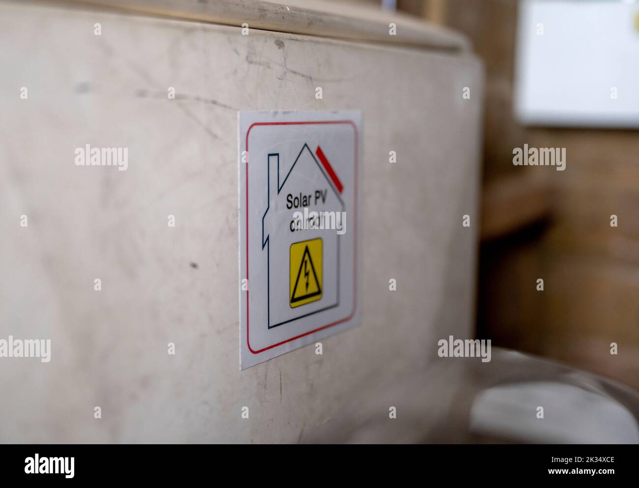 Solar on roof warning sticker on a domestic meter box Stock Photo - Alamy