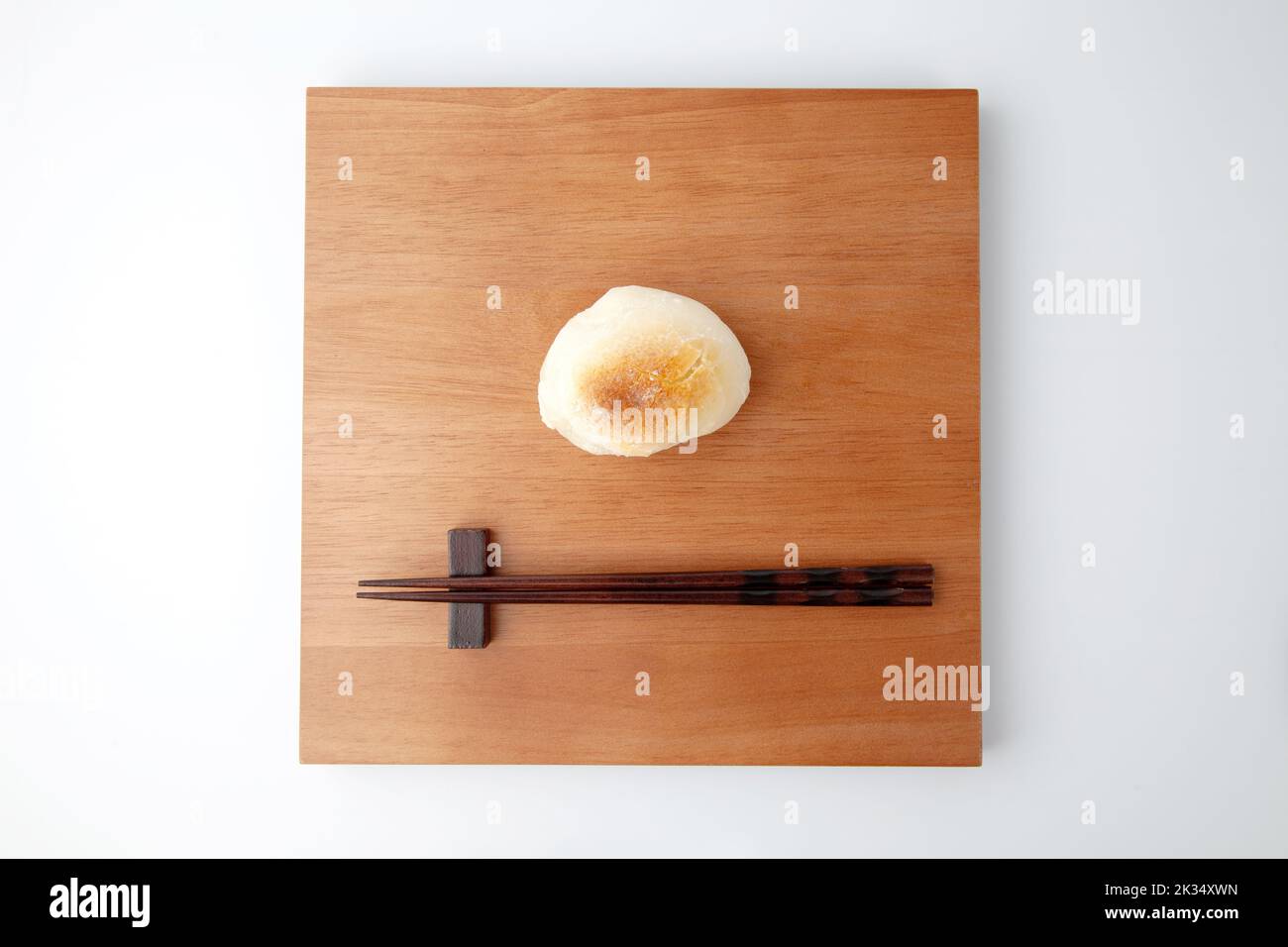 baked rice cake on plate isolated on white background Stock Photo - Alamy