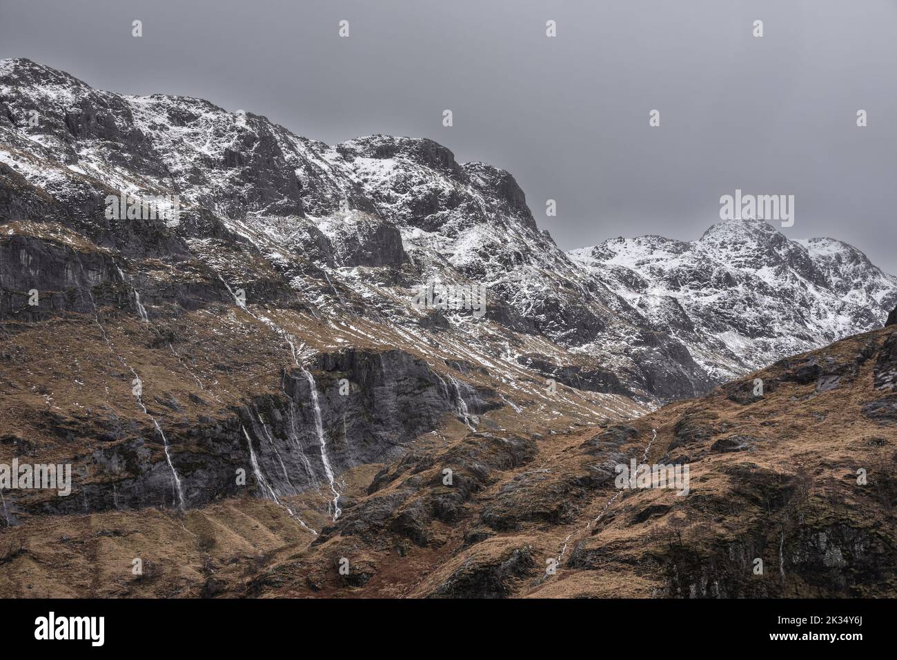 Epic Winter landscape image of snowcapped Three Sisters mountain range ...