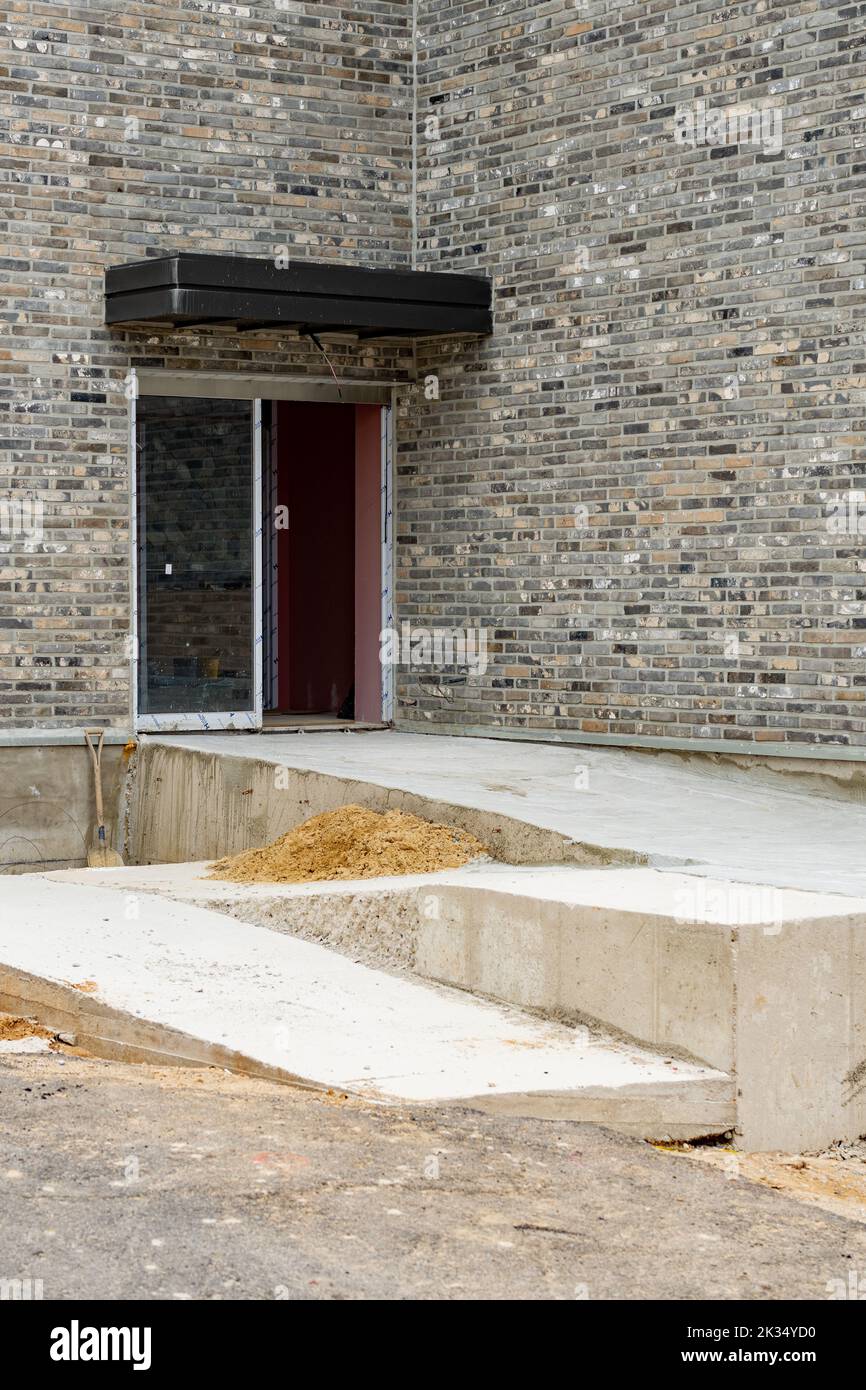A view of a door of a modern building from a construction site Stock ...