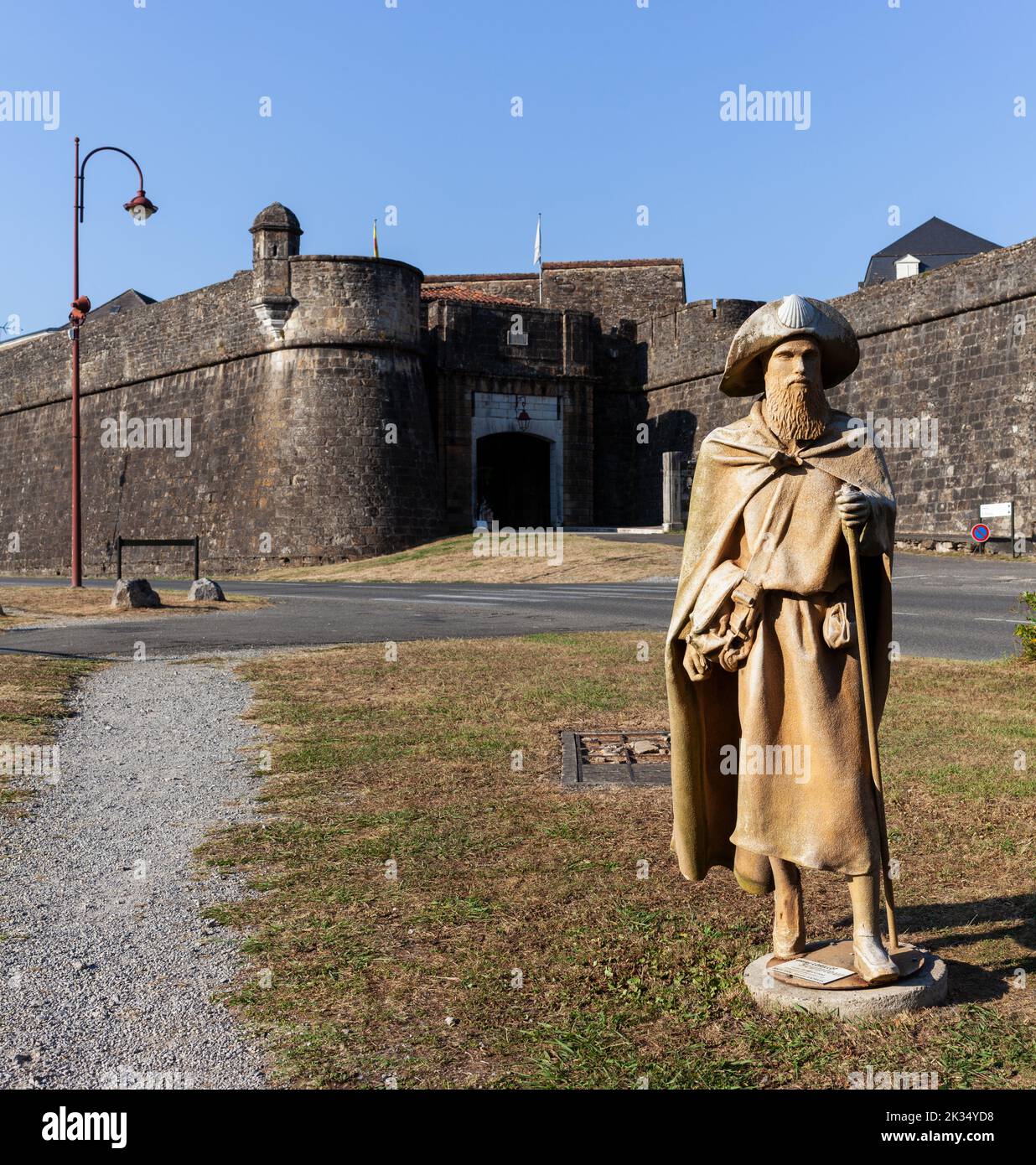 Pilgrims statue near the fortified medieval walls of the French town ...