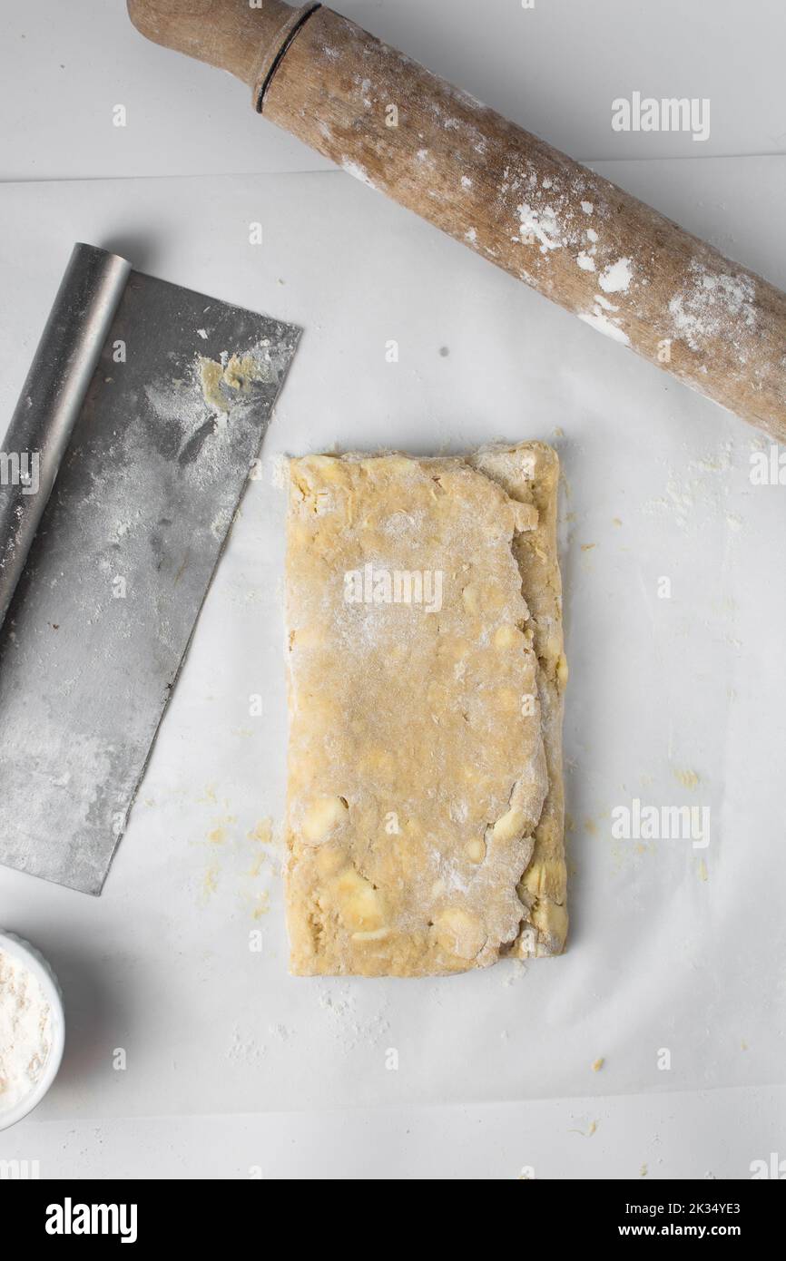 danish pastry dough being laminated, pastry dough with pieces of cold ...