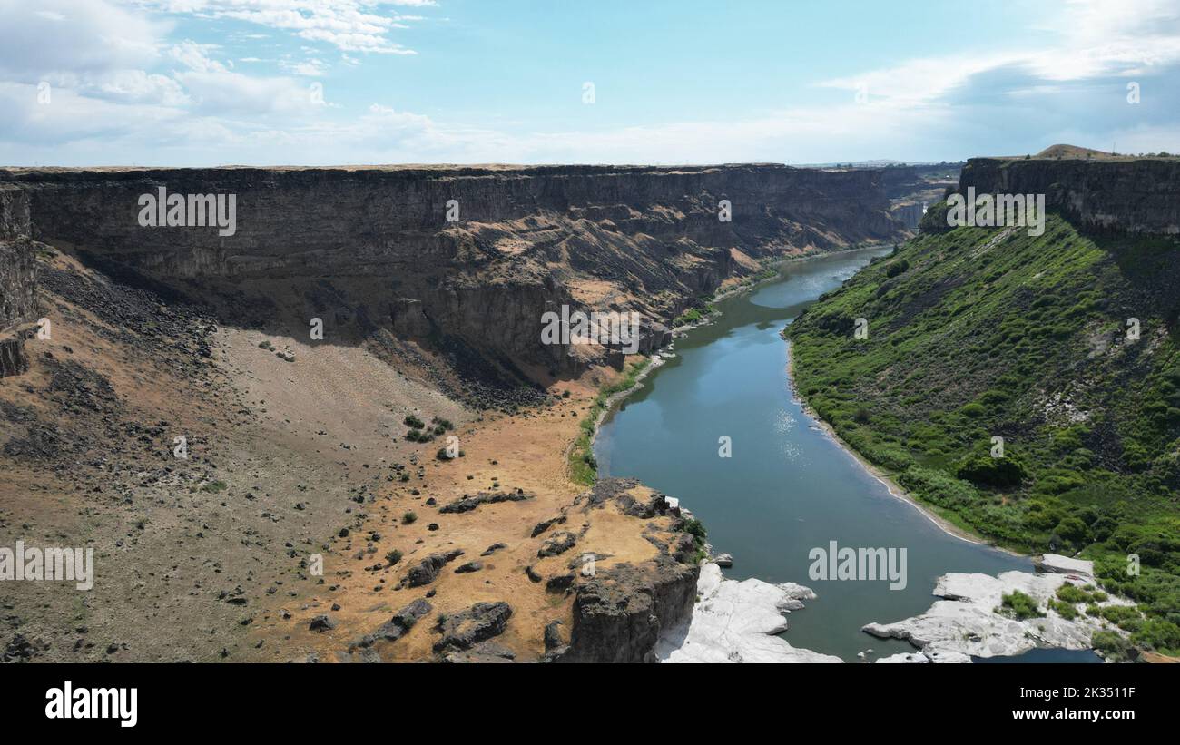 A beautiful view of a river surrounded by geological formations with ...