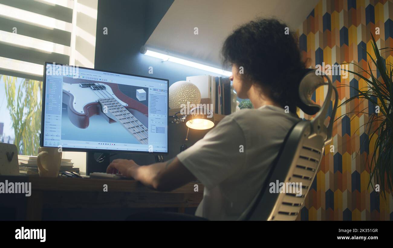 Young Guy Creating 3d Prototype Of Guitar Using Modern Personal