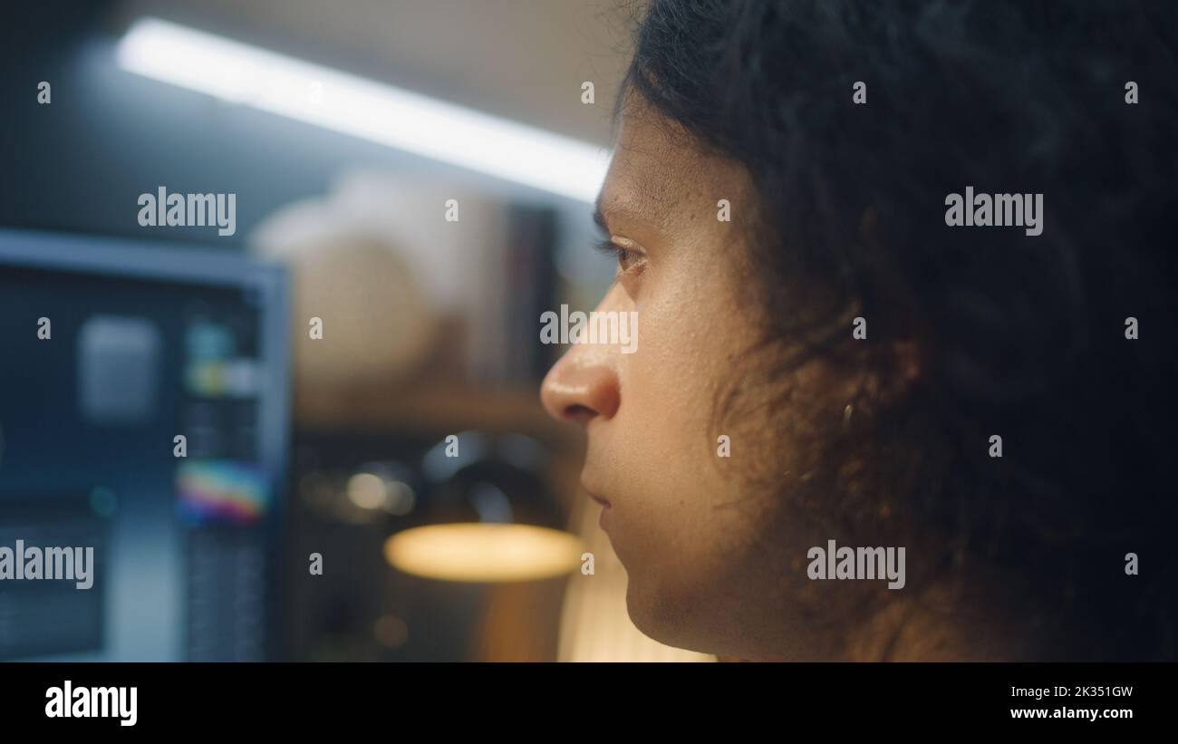 Close-up of focused man looking at the screen of computer while working ...