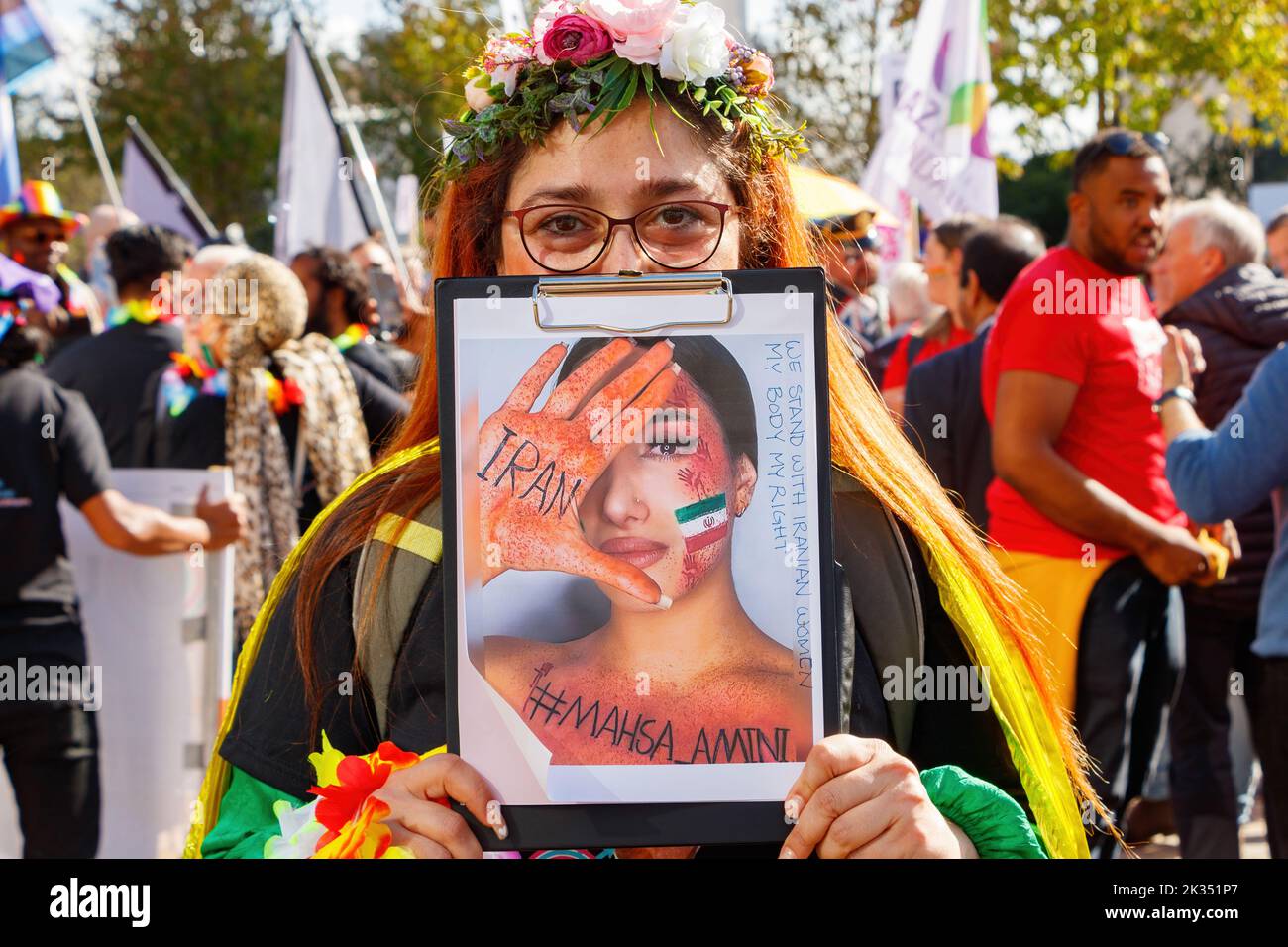 asian woman with sign placard against iran death mahsa amini Gay Pride ...