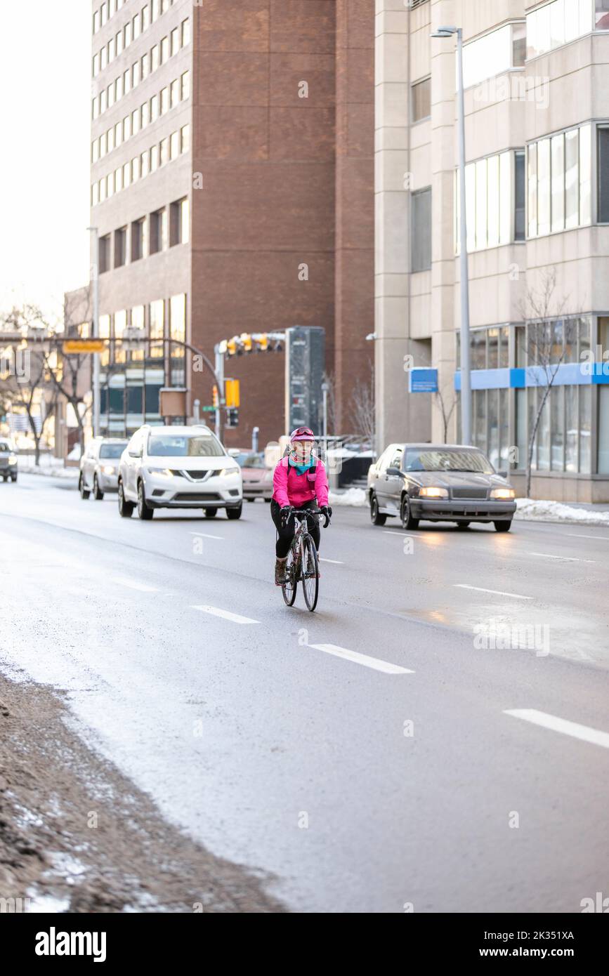 Riding bicycle downtown hi-res stock photography and images - Alamy