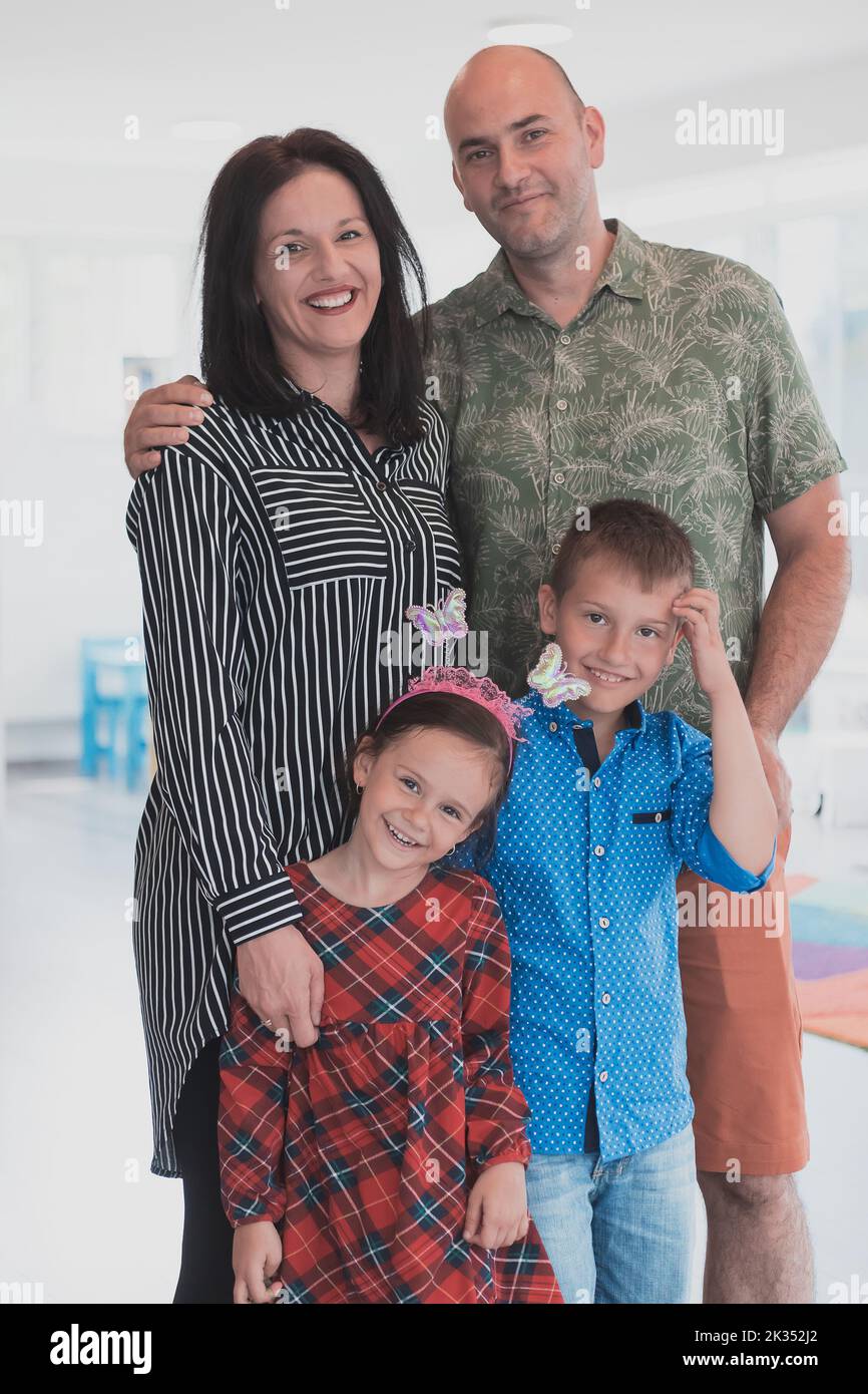 Portrait of a happy family. Photo of parents with children in a modern ...