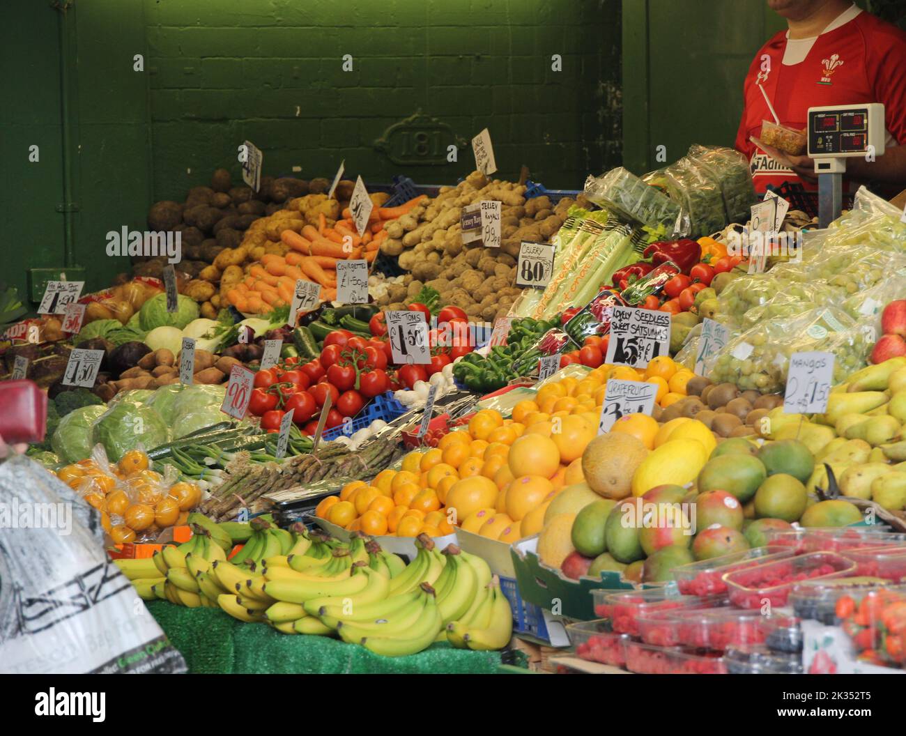 a display of fruits and vegetables in a marketplace Stock Photo - Alamy