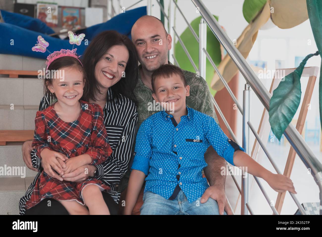 Portrait of a happy family. Photo of parents with children in a modern ...