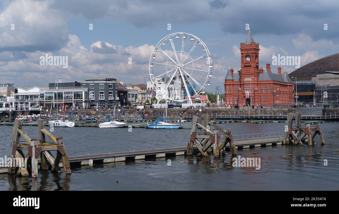 A scenic shot of Cardiff Bay with the Ferris wheel and the urban city ...