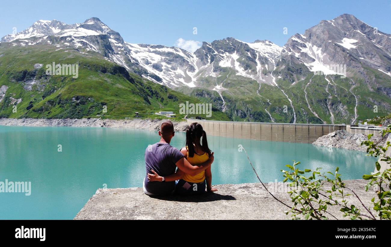 A couple enjoying the greenery waterscape and mountains in Kaprun ...