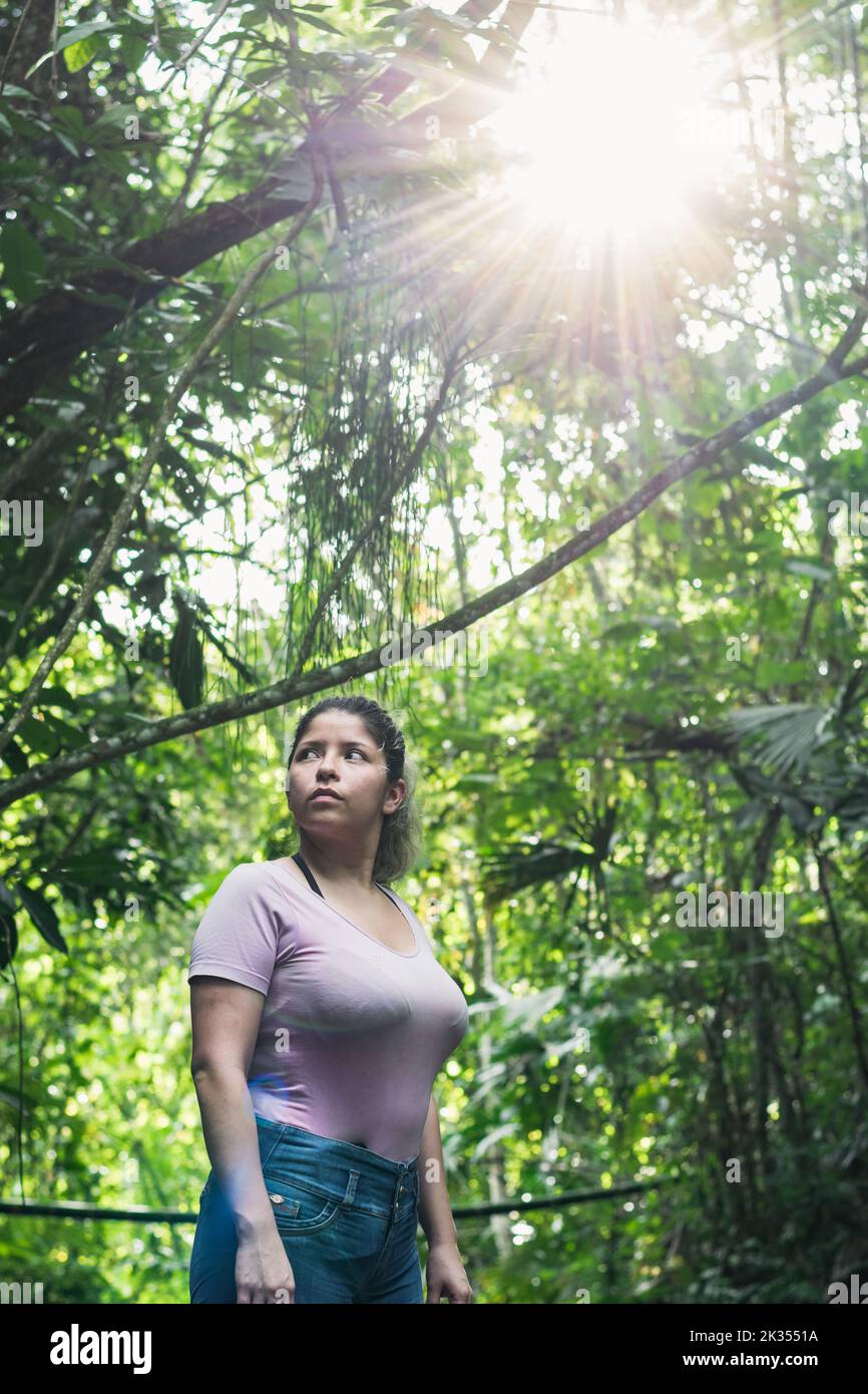 beautiful latin girl exploring in the middle of a colombian jungle ...