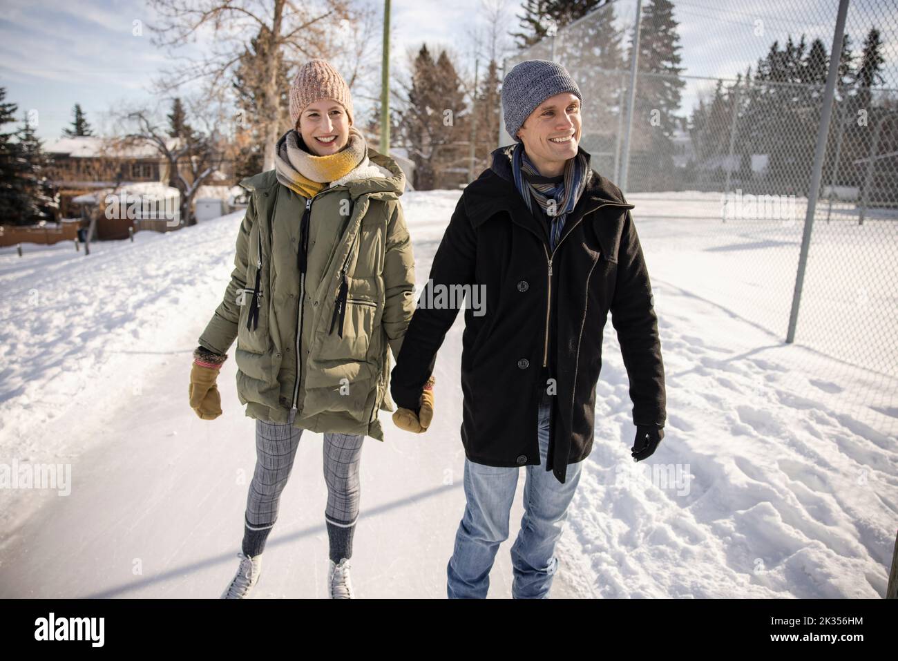 Holding hands ice skating hi-res stock photography and images - Alamy