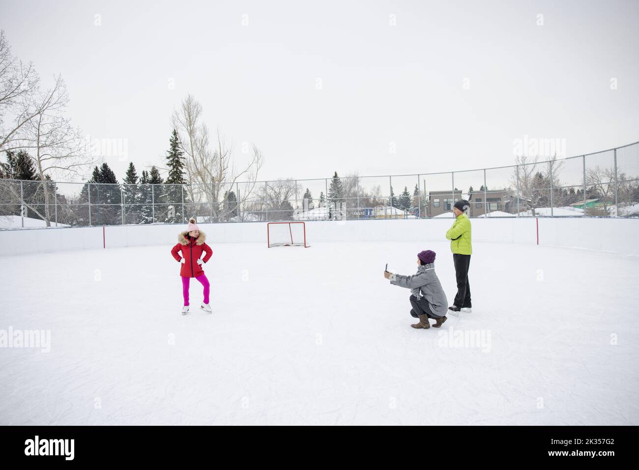 Parents watching daughter skate hi-res stock photography and images - Alamy