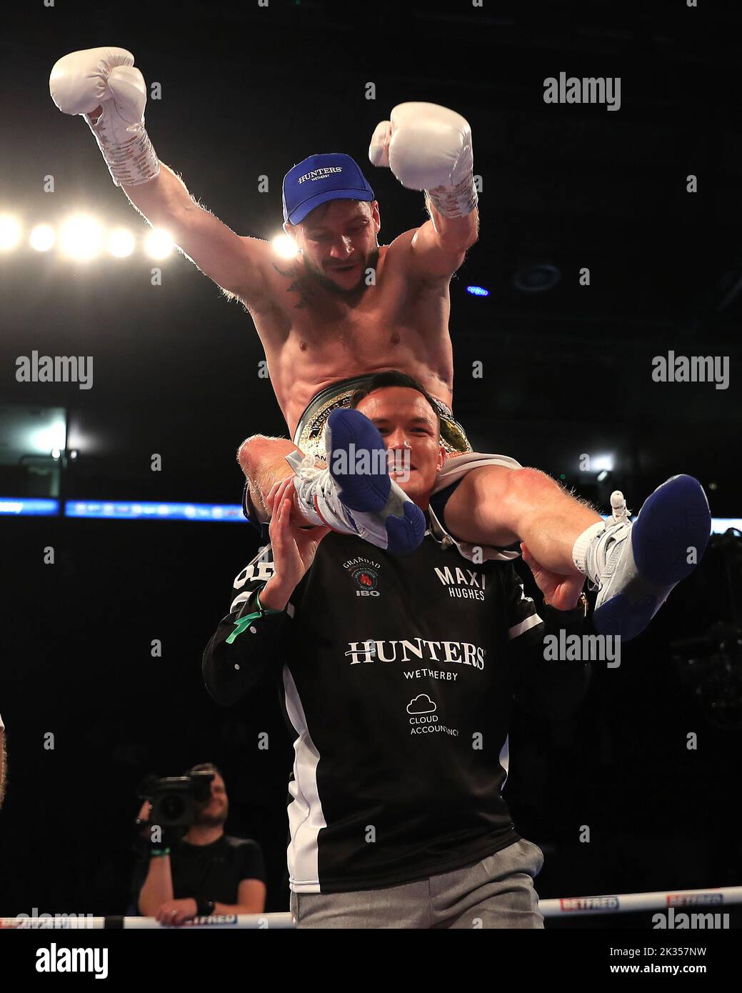 Maxi Hughes is lifted up by Josh Warrington after his victory in the ...