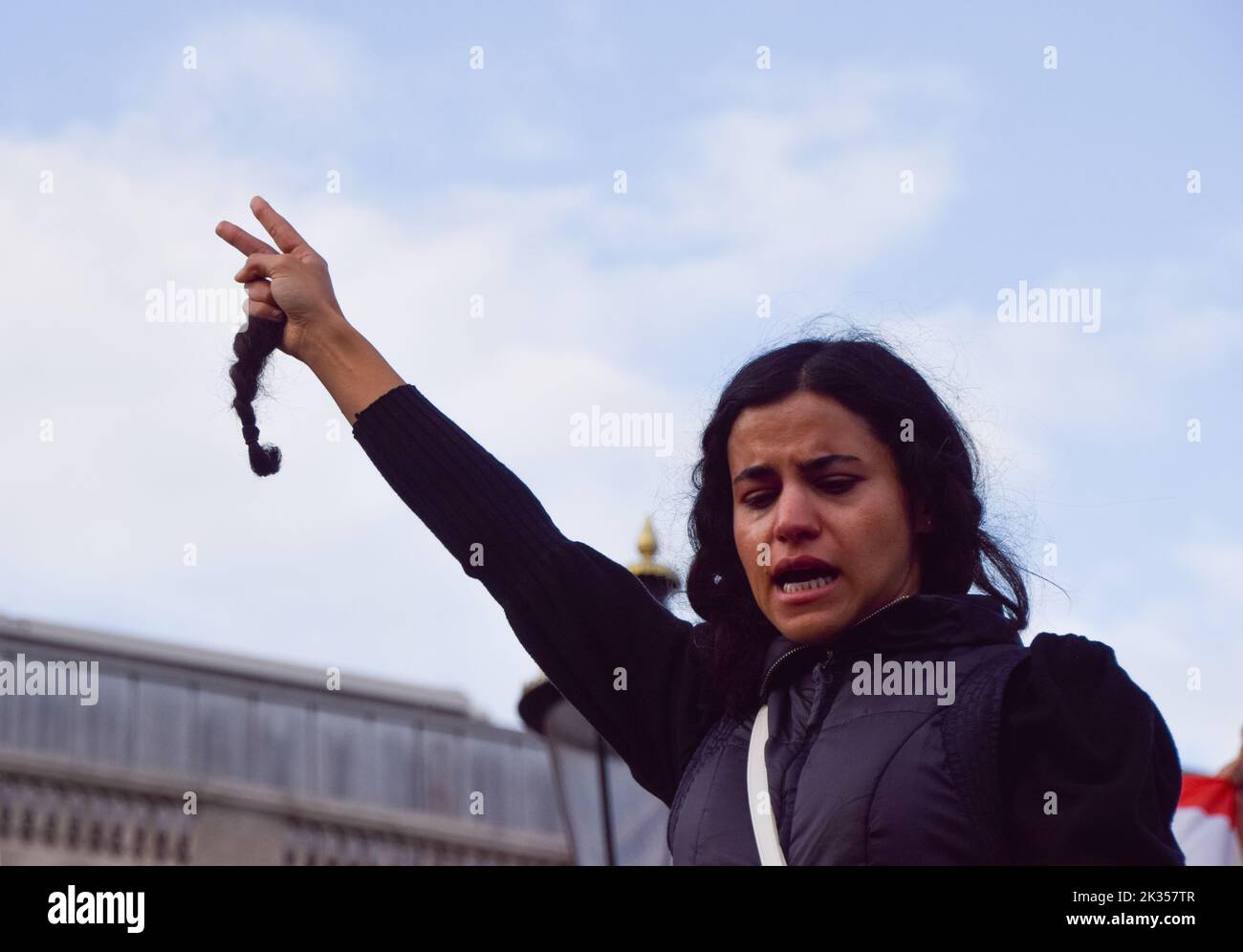 London, England, UK. 24th Sep, 2022. A woman holds a cut lock of her ...