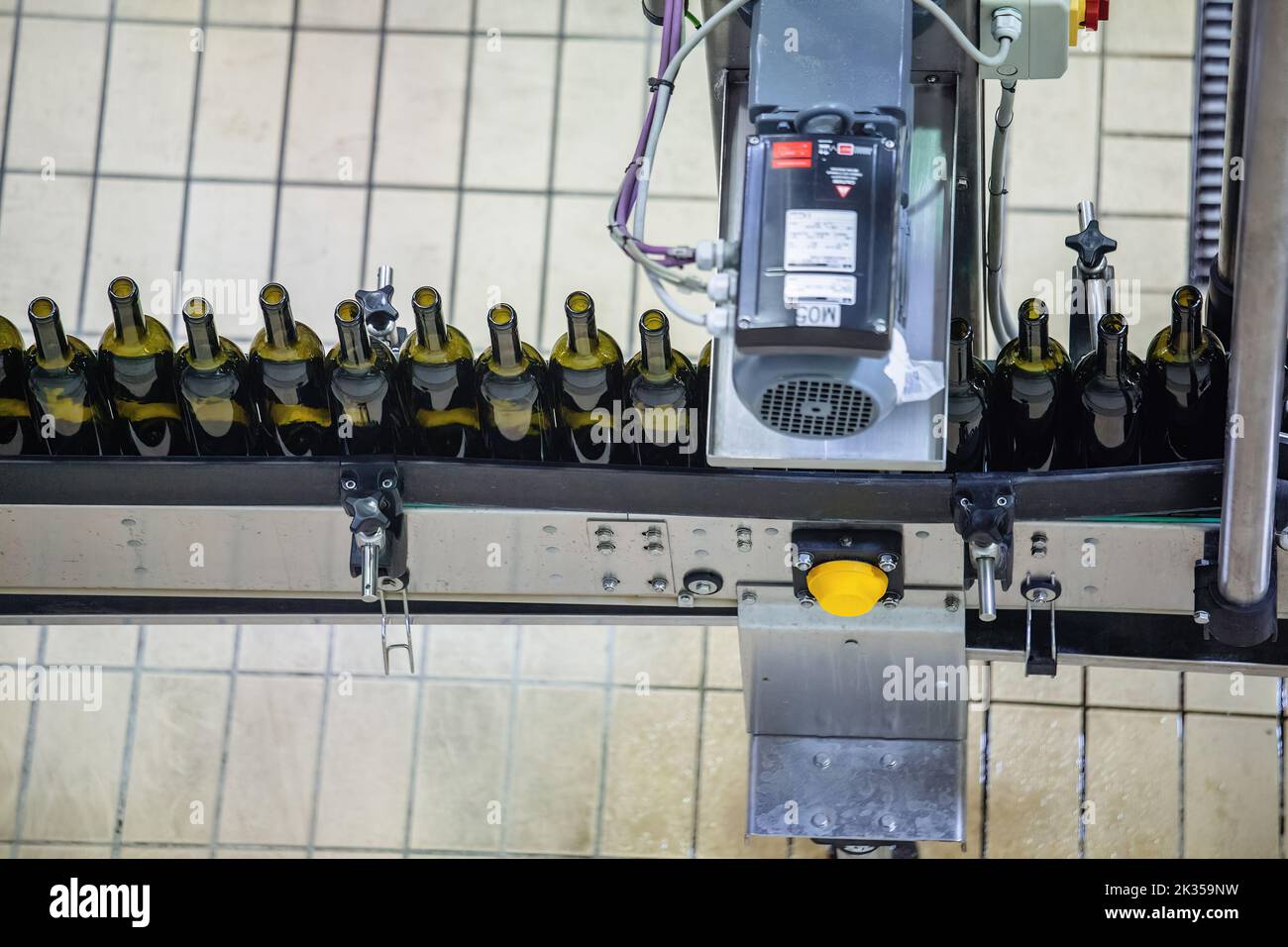 Bottling and sealing wine conveyor production line at modern winery ...
