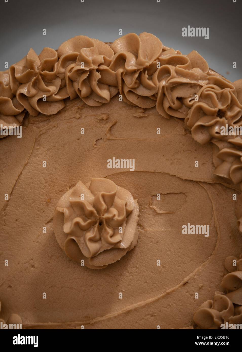 a vertical high angle of a cake with designs made out of icing Stock ...