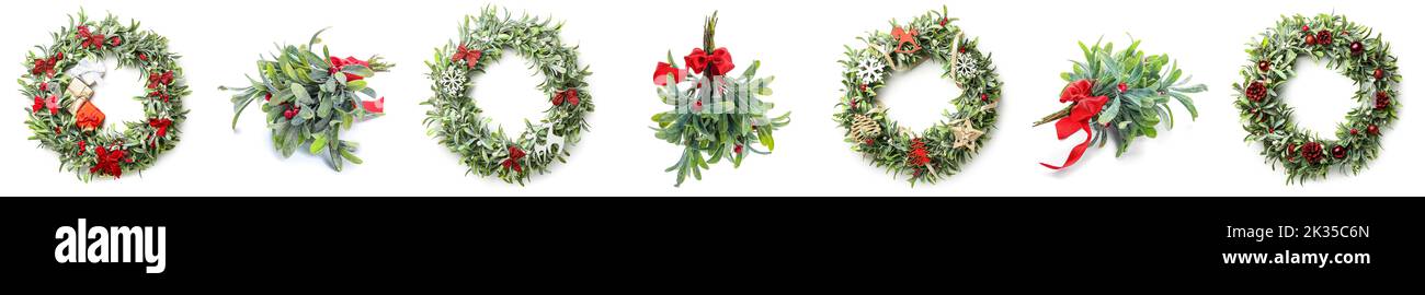Set of mistletoe branches and wreaths isolated on white Stock Photo - Alamy