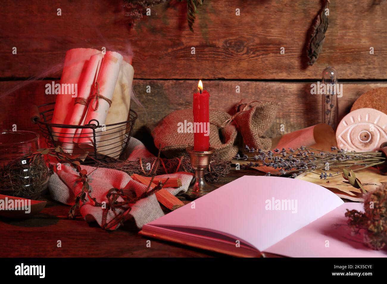 Magic attributes for ritual on wizard table against wooden background ...