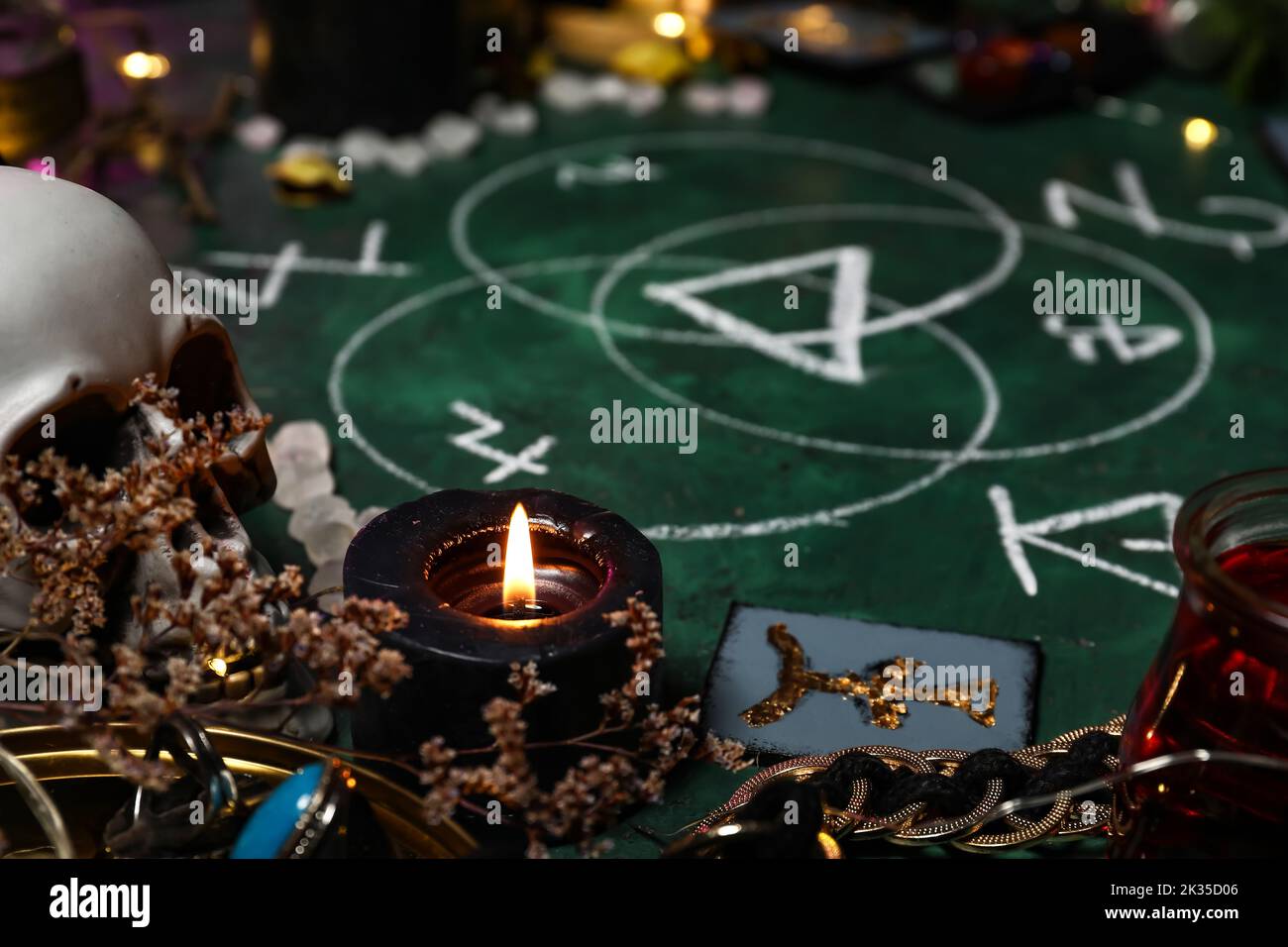 Magic attributes and symbols drawn for ritual on table Stock Photo - Alamy