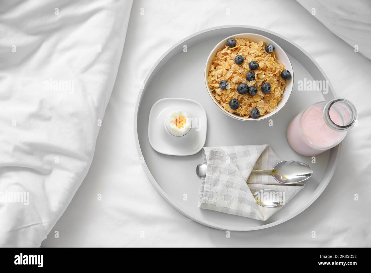 Tray with healthy breakfast on bed Stock Photo - Alamy