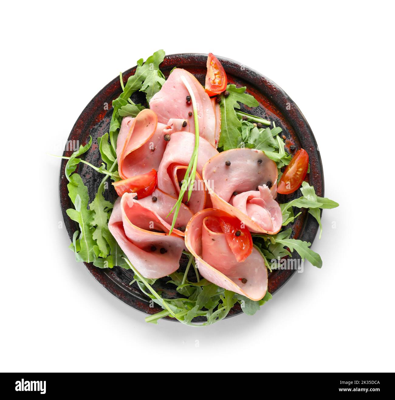 Plate with sliced ham isolated on white background Stock Photo - Alamy