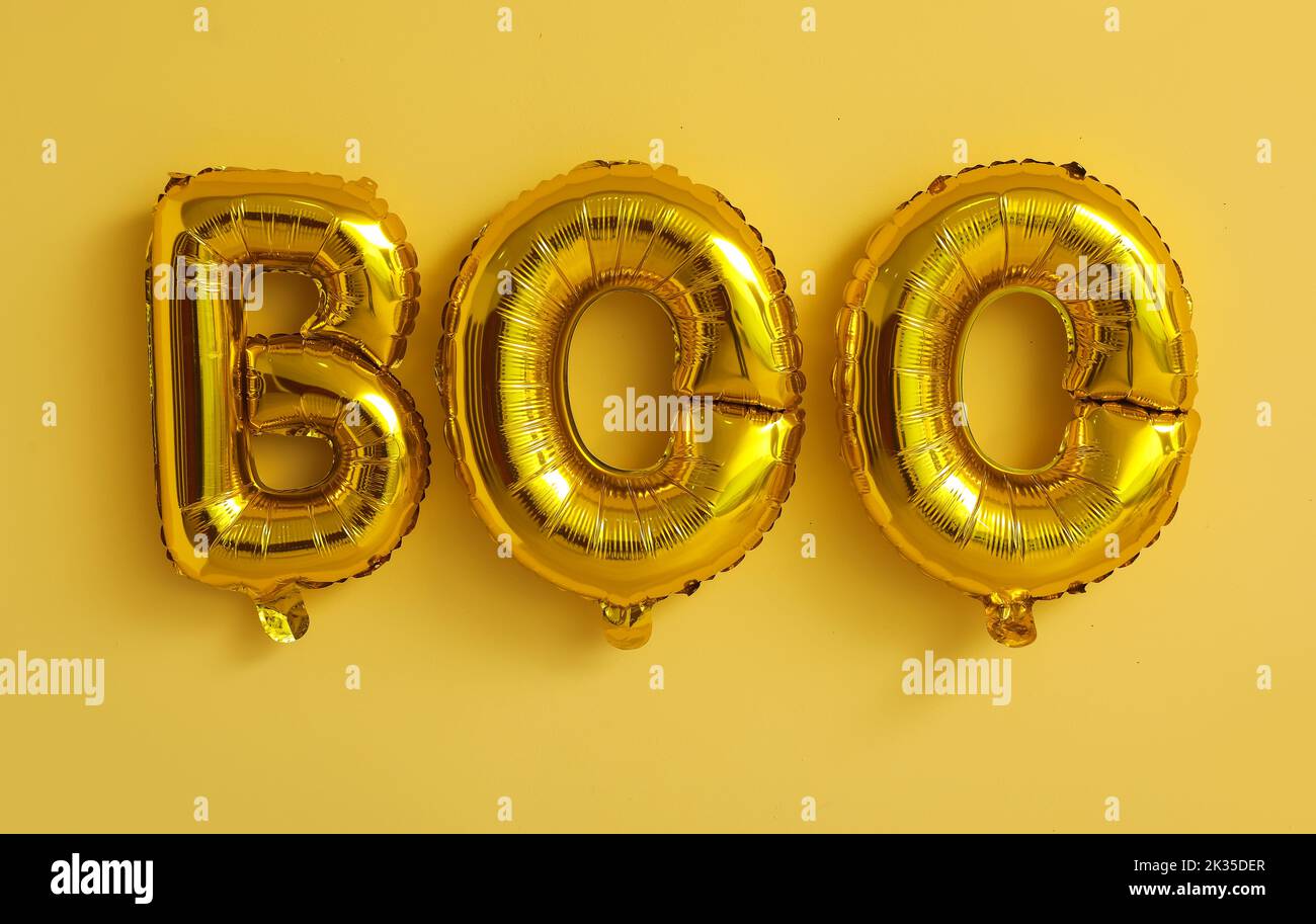 Word BOO made of balloons on yellow background. Halloween celebration ...