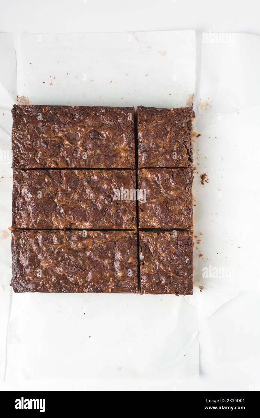 Flat lay of brownies, brownies that have been cut into squares, caramel ...