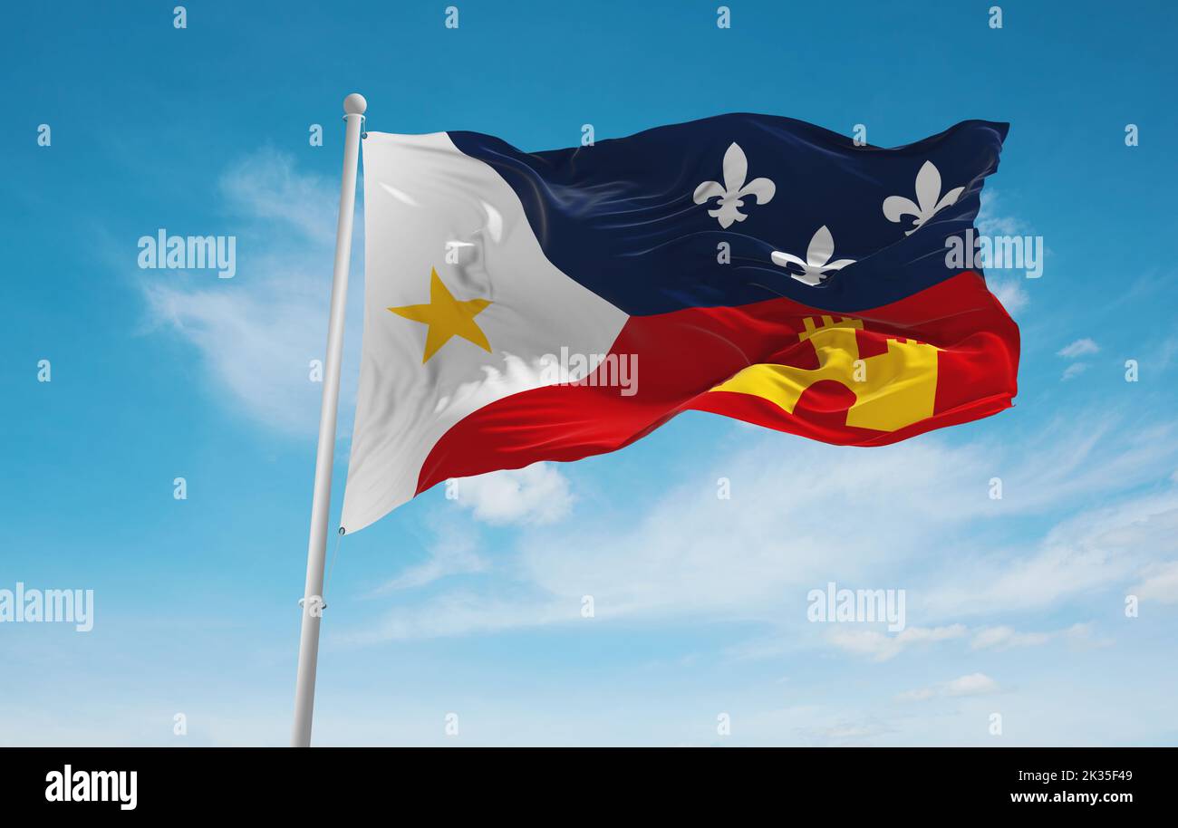 official flag of Acadiana untied states of America at cloudy sky ...