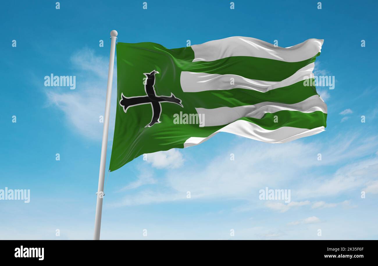 official flag of Anasco untied states of America at cloudy sky ...