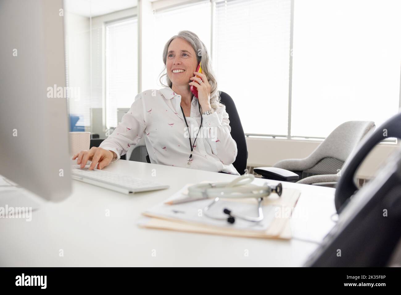Smart woman at doctor hi-res stock photography and images - Alamy