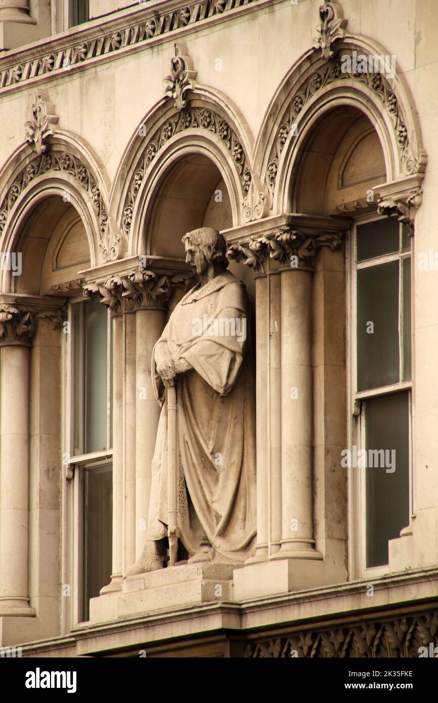 A vertical shot of a statue as a part of the exterior design of an ...