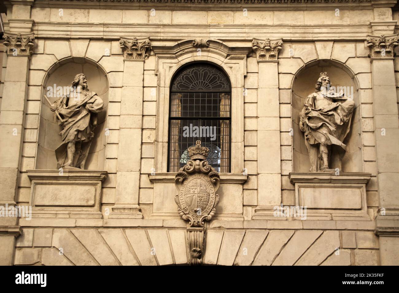 A statues as a part of the exterior design of an ancient architecture ...