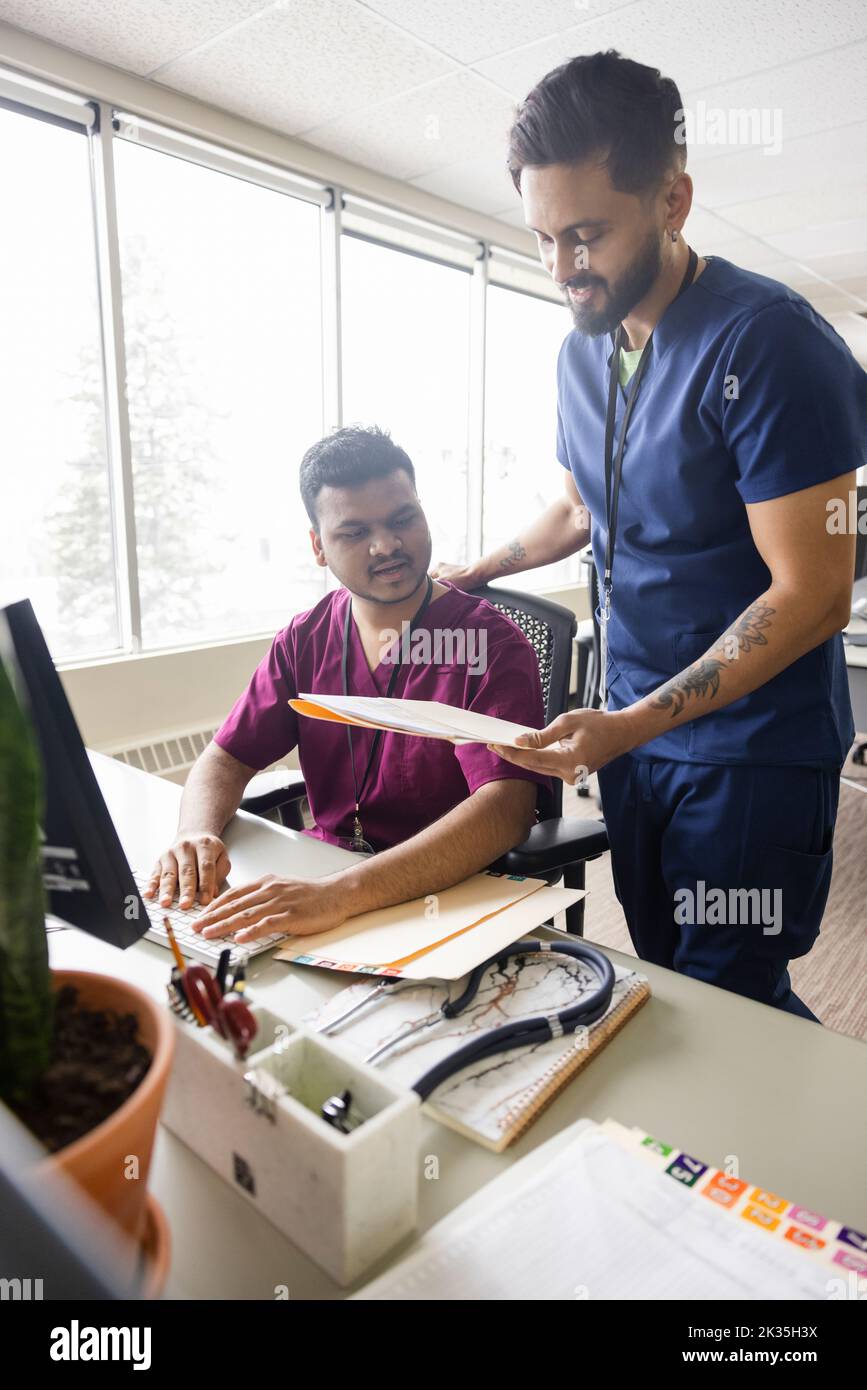 Nurse charting hi-res stock photography and images - Alamy