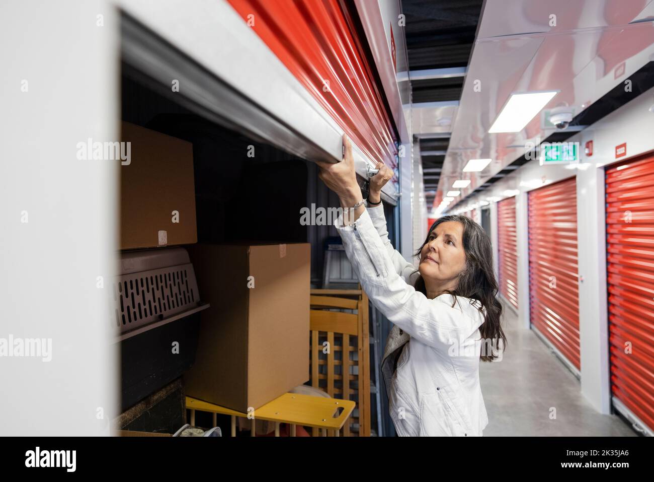 Mature woman arms raised door hi-res stock photography and images - Alamy