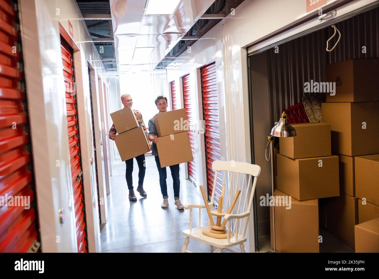 Two men carrying boxes hi-res stock photography and images - Alamy