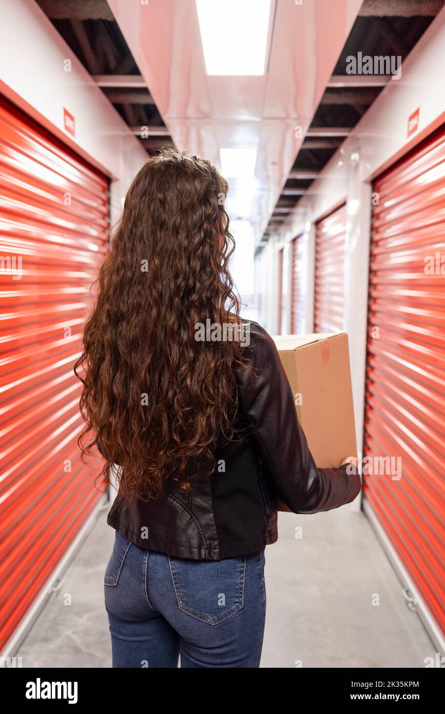 Person carrying box walking hi-res stock photography and images - Alamy