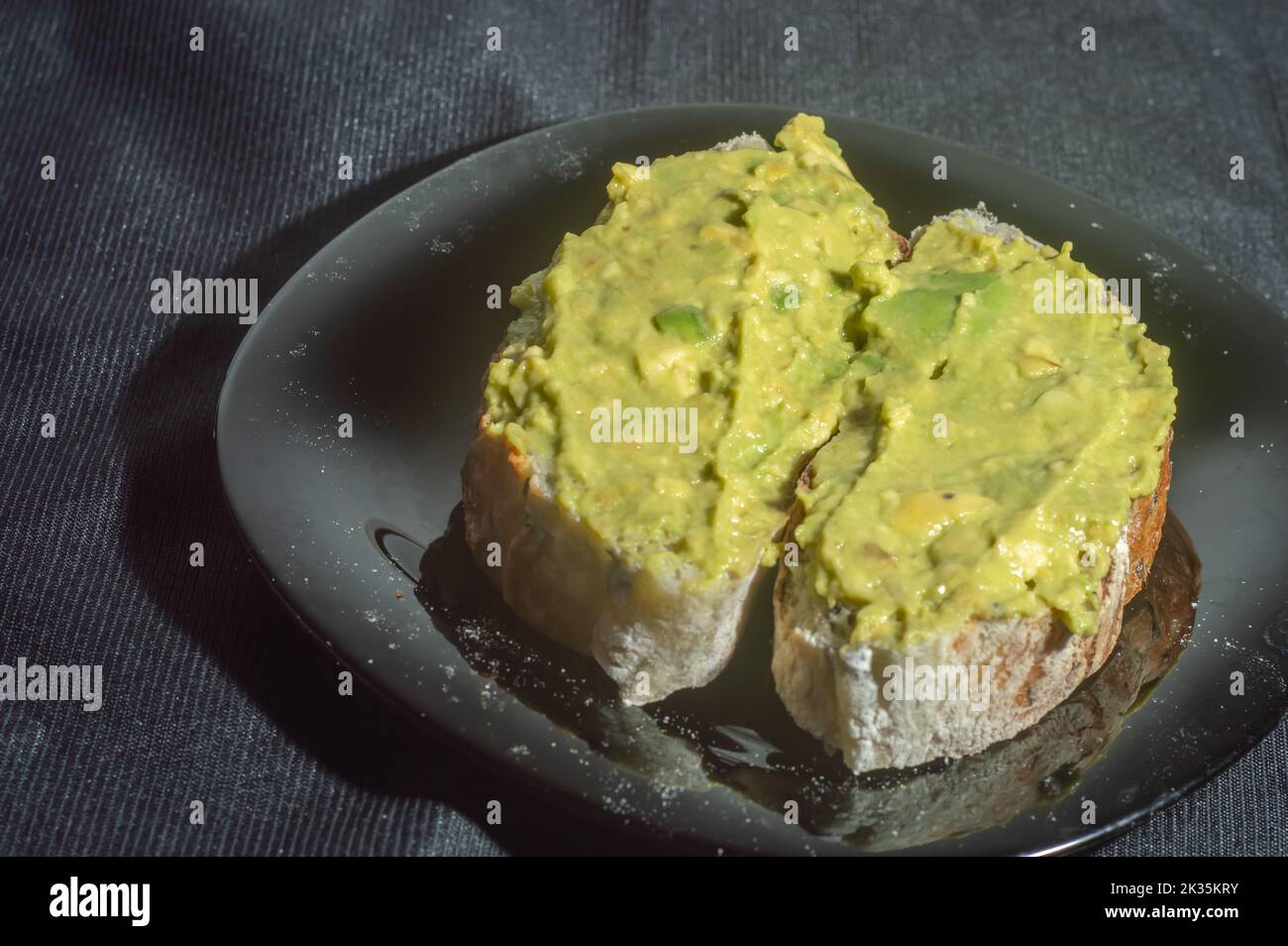 Handmade bread with natural ferment and avocado paste on top of bread ...