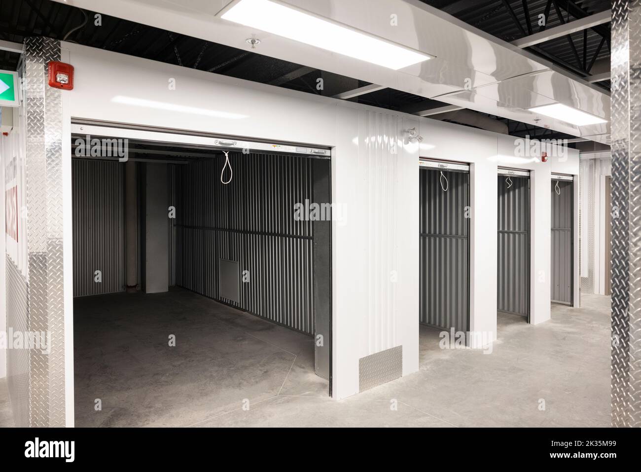 Empty storage facility lockers with open doors Stock Photo - Alamy