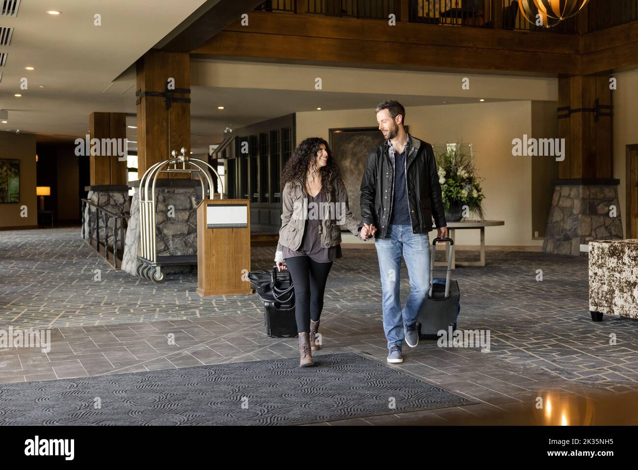 Two people walking through door hi-res stock photography and images - Alamy